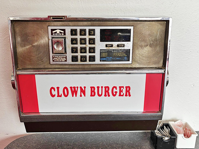 A classic wall-mounted jukebox that whispers promises of simpler times when music and meals went hand in hand.