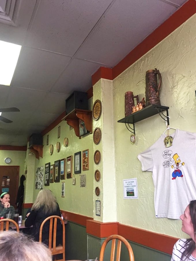 The walls tell stories of Polish heritage with decorative plates, vintage steins, and the unmistakable red and white Polish eagle watching over diners.