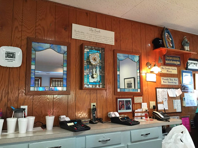 Stained glass mirrors and wood paneling create that "been here forever" vibe that no designer could authentically replicate.