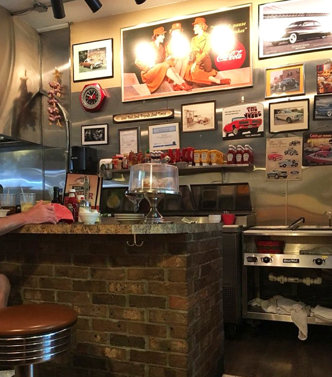 The wall of vintage memorabilia isn't manufactured nostalgia - it's the real deal, collected over decades of serving the community.