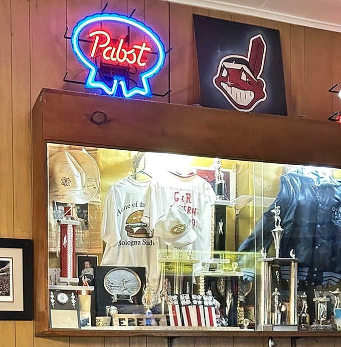 Wall decorations collected over decades tell stories of local pride, sports loyalties, and the tavern's rightful place in Ohio food history.