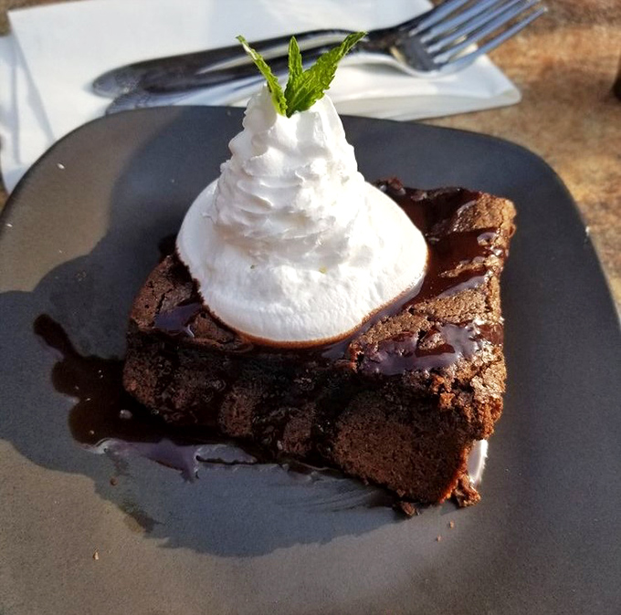 Warm brownie meets cool whipped cream in a dessert romance that'll make you forget all your troubles.