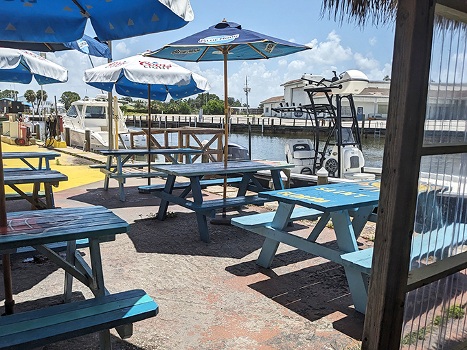 Waterside tables where boats become part of the ambiance. Your reservation includes a side of nautical envy.