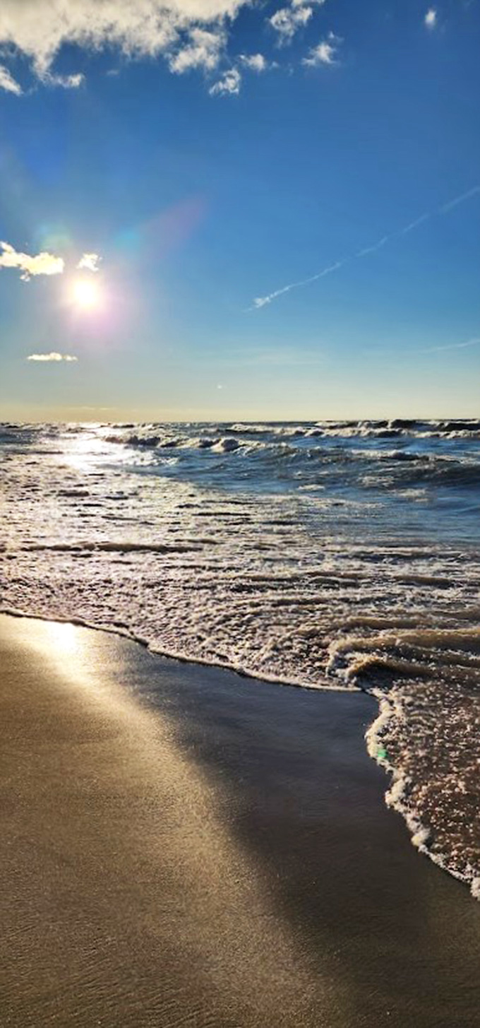 Lake Michigan showing off its ocean impression with waves that sparkle like diamonds in the midday sun.