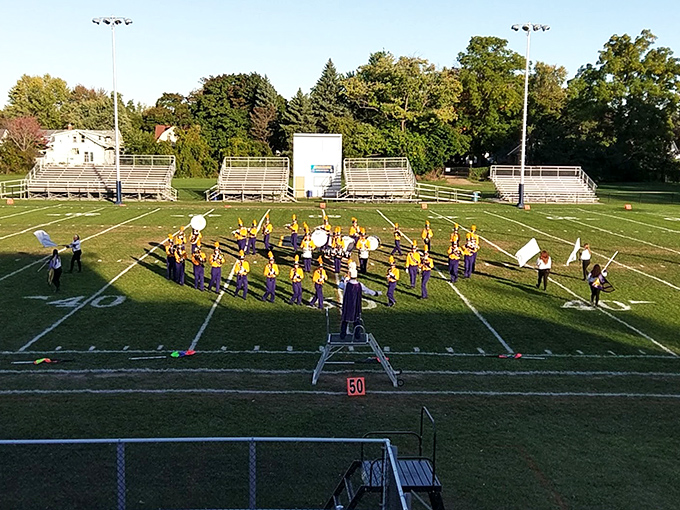 Friday night lights shine brightest in towns like Owosso, where high school bands and hometown pride create pure Americana magic.