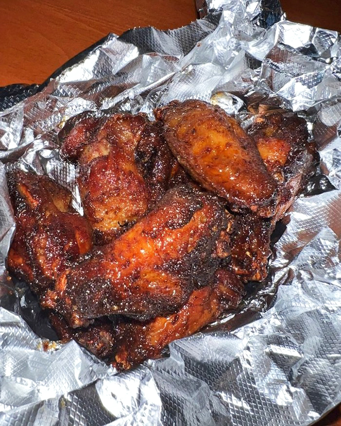 Wings with a mahogany sheen that signals flavor depth worth writing home about. The kind of wings that make you wonder why you ever bothered with buffalo.