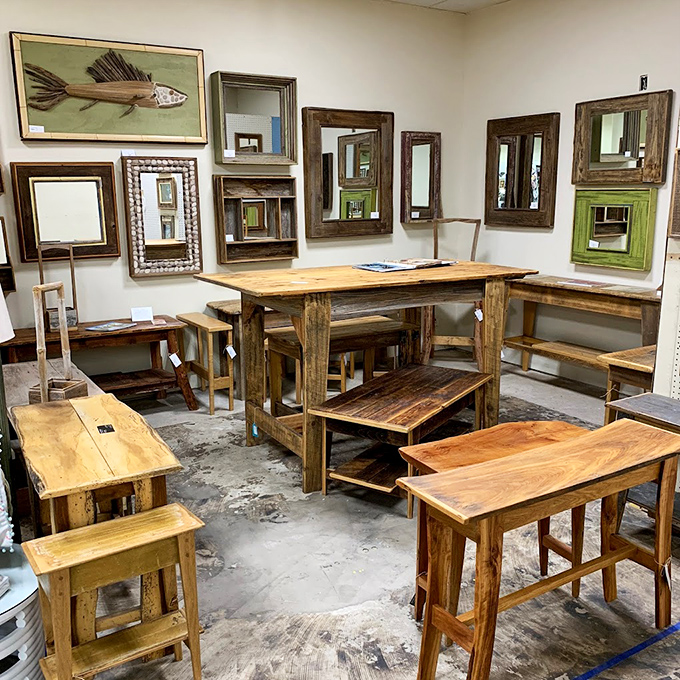 Reclaimed wood furniture and rustic mirrors create a warm, earthy display that has "farmhouse renovation" written all over it&mdash;Joanna Gaines would approve.