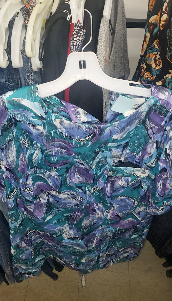 Abstract watercolor vibes on this blouse would make any art gallery docent proud &ndash; wearable creativity at a fraction of boutique prices.