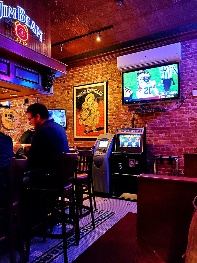 Even the entertainment corner maintains that classic neighborhood vibe. Where else can you play Pennsylvania Skill games under a vintage Cointreau poster?