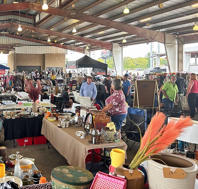 Tables laden with yesterday's treasures create narrow pathways of possibility – the thrill of the hunt captured in one crowded, glorious scene.
