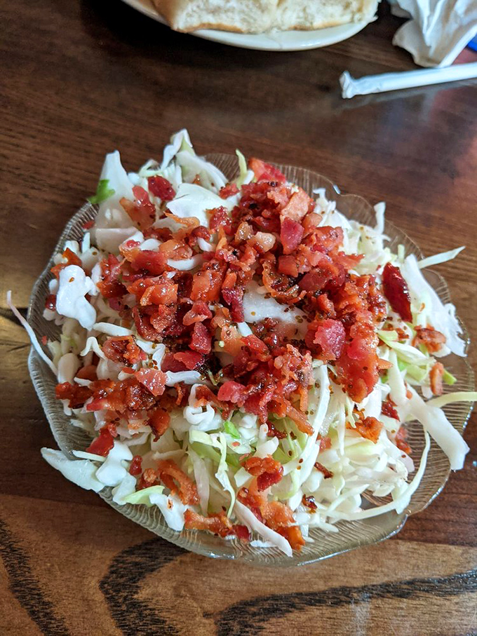 Coleslaw elevated with bacon bits&mdash;because in the Midwest, we know everything is better with a sprinkle of pork confetti.