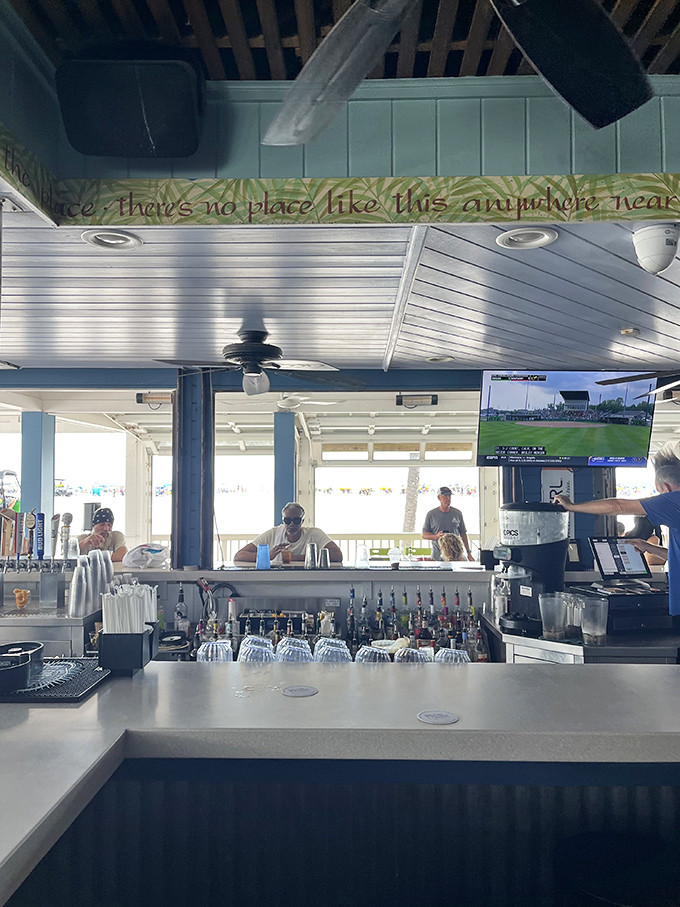 "There's no place like this anywhere near"&mdash;the sign above the bar speaks truth as bartenders craft cocktails with the Gulf as their backdrop.