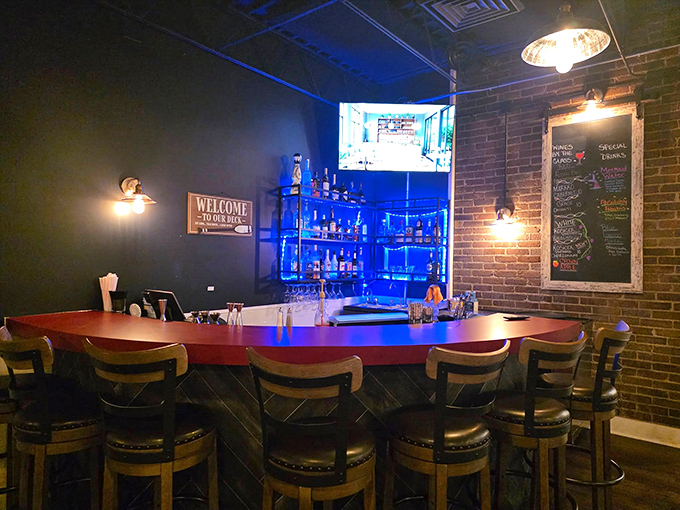 The bar area glows with blue light like you're dining under the sea. Perfect spot to debate the merits of New England versus Manhattan clam chowder.