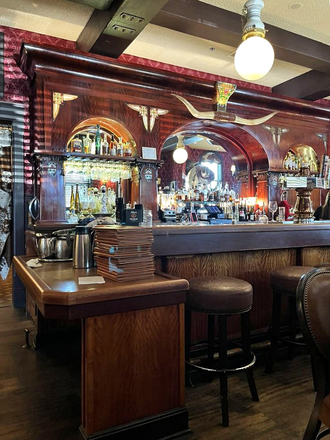 Not just a bar, but a time machine with spirits. The polished wood and vintage details create the perfect stage for old-fashioned hospitality.