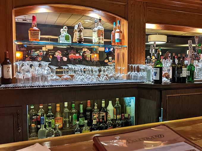 The bar area—where locals have been solving the world's problems over cocktails for decades. If these bottles could talk...