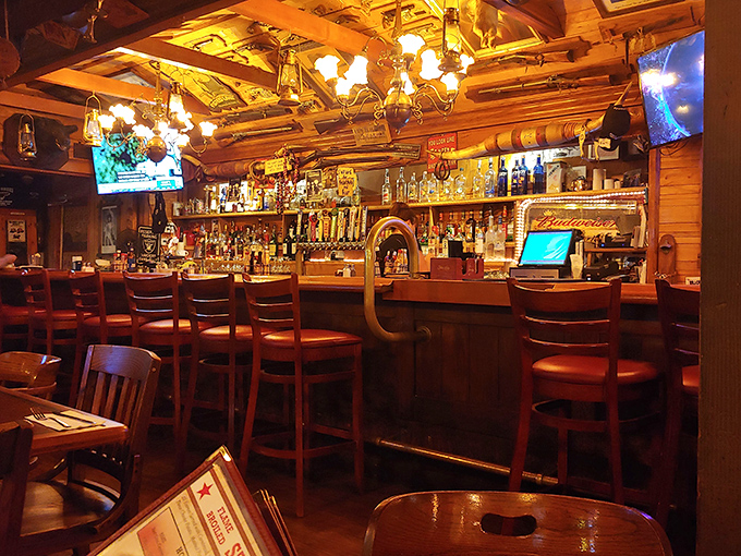The bar area glows with amber warmth, offering a front-row seat to the mixology magic and a chance to swap stories with locals.