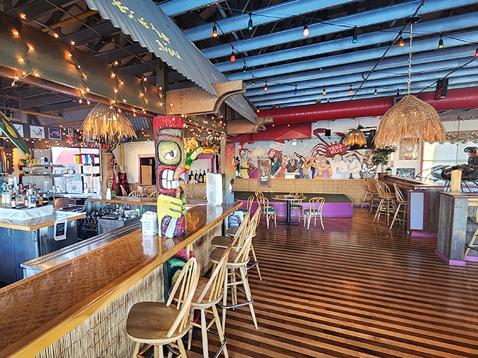 Tiki-inspired bar area where grass skirt decor meets nautical flair &ndash; a playful space where rum drinks and sea shanties wouldn't feel out of place.