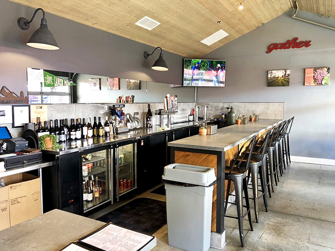 The sleek bar area offers local wines and craft beers, creating the perfect liquid companions for smoky meat adventures.