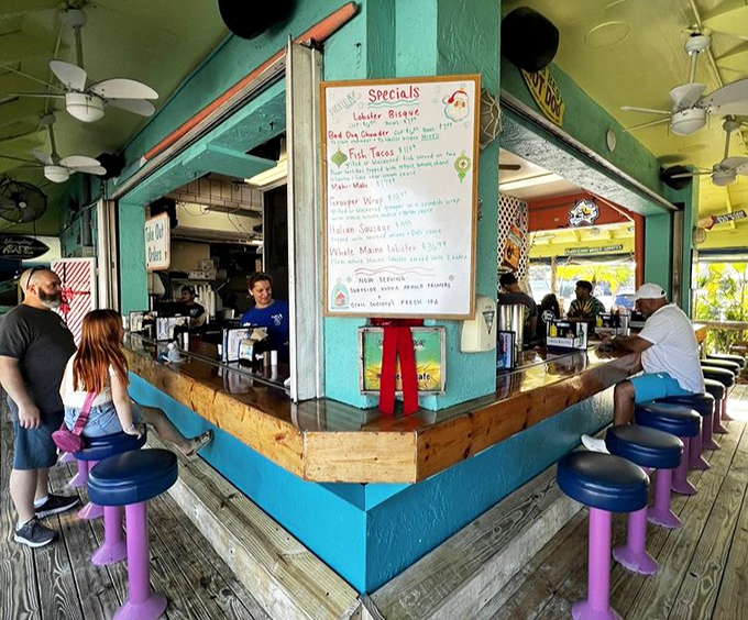 The corner bar where regulars have worn grooves in their favorite seats. Daily specials board promises new adventures for your taste buds.