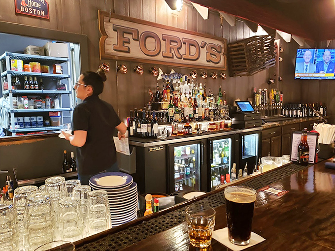 The bar area balances nautical charm with serious libations. That wooden "FORD'S" sign has witnessed countless toasts to good catches &ndash; both seafood and first dates.