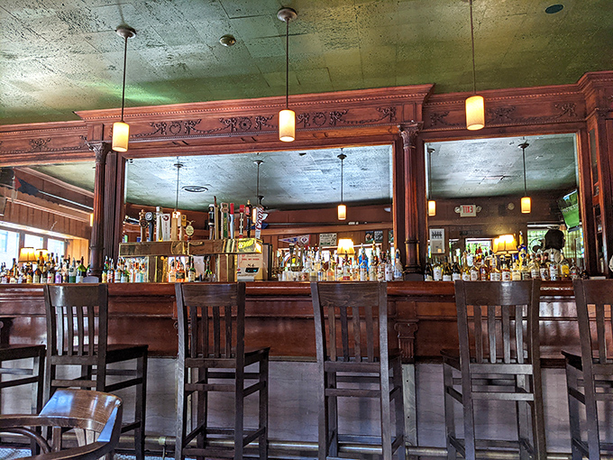 That bar has supported more elbows, stories, and cold beers than most of us have had hot meals.
