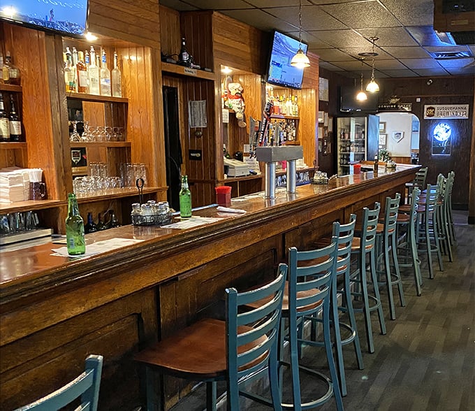 The bar's worn wooden surface tells stories of countless elbows, raised glasses, and "you've gotta try this" conversations.