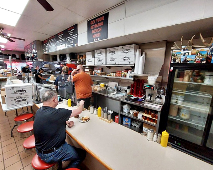 Counter seating: where the regulars perch and first-timers become converts. The red stools have witnessed countless "first bite" moments of pure sandwich bliss. 