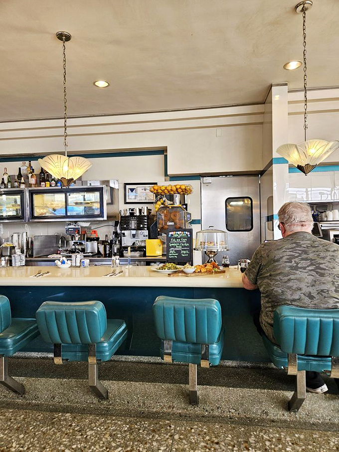 The counter is where the magic happens&mdash;where regulars perch on teal stools and coffee appears before you've even thought to ask.