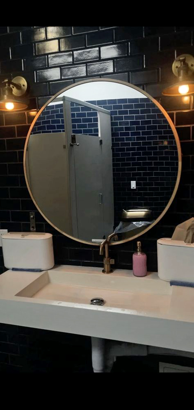 Even the restroom carries the nautical theme with navy tiles that make you feel like you're freshening up on a luxury yacht.