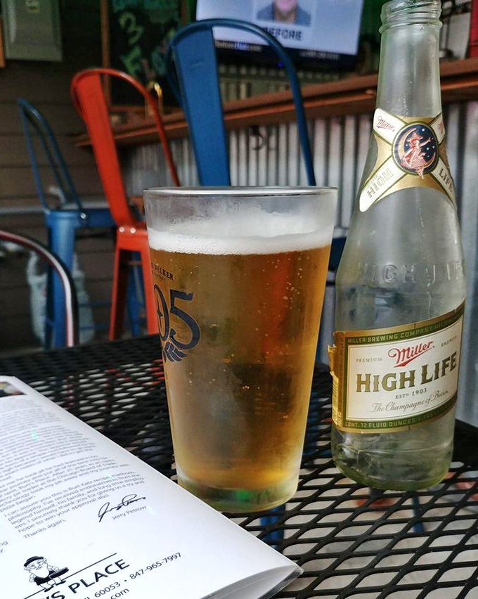 A cold Miller High Life alongside the menu&mdash;sometimes the champagne of beers is the perfect companion for pizza royalty.