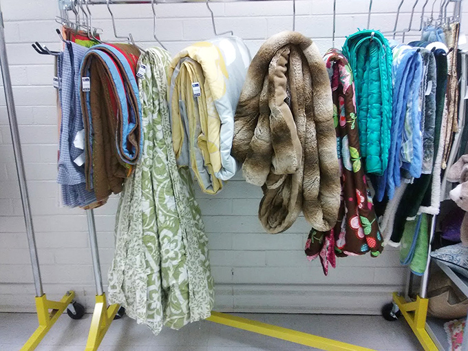 The blanket and bedding section: a textile rainbow where your next picnic blanket or cozy throw awaits its forever home.