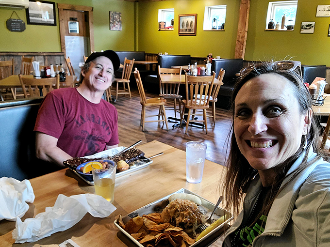 Happy diners with plates that tell the whole story. When the food makes you smile like that, words become entirely optional.