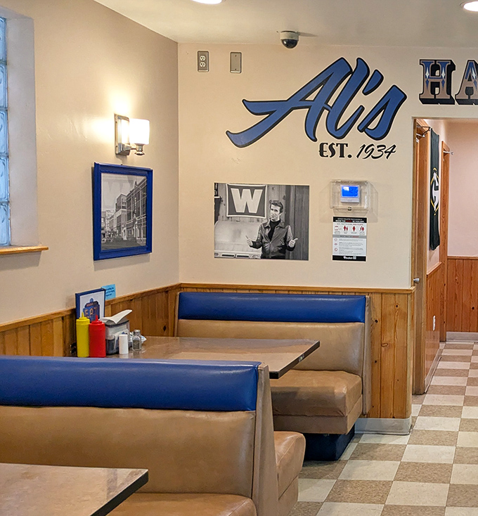 Blue vinyl booths that have cradled more Green Bay celebrations and consolations than any therapist's couch in town.