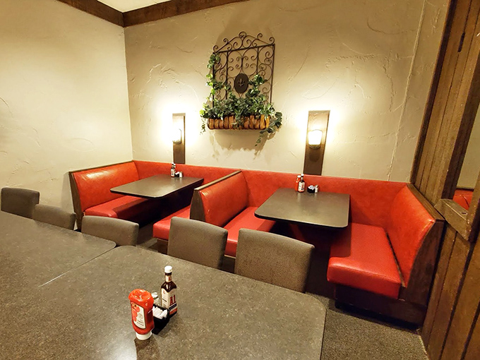 Red vinyl booths cradle conversations and comfort food equally well, providing the perfect backdrop for meals that feel like homecomings.