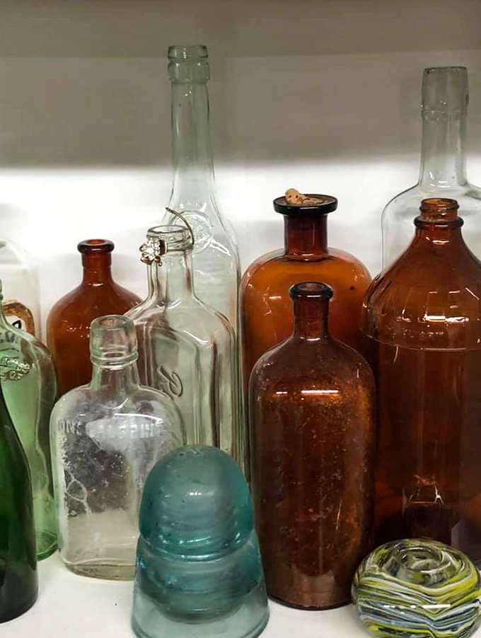 Antique bottles in amber and aqua—silent witnesses to history now ready for their Pinterest-worthy afterlife on your windowsill.