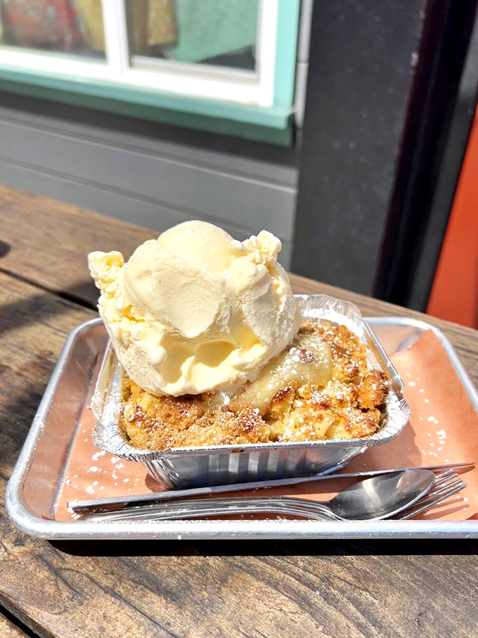 Bread pudding topped with ice cream: because after conquering mountains of meat, you deserve a sweet victory lap.