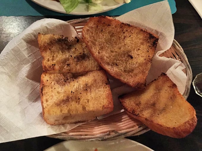 Garlic bread so buttery and aromatic it should come with a warning label: "May cause spontaneous expressions of joy."