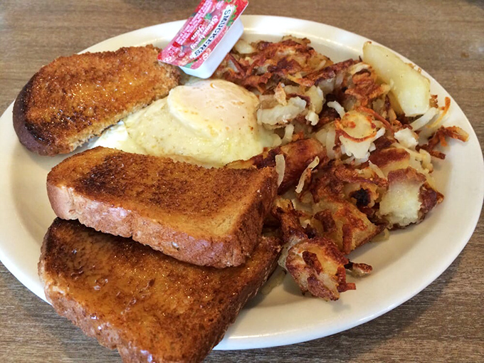 The breakfast trinity: perfectly toasted bread, eggs that remember they came from chickens, and home fries with that ideal crispy-to-tender balance.