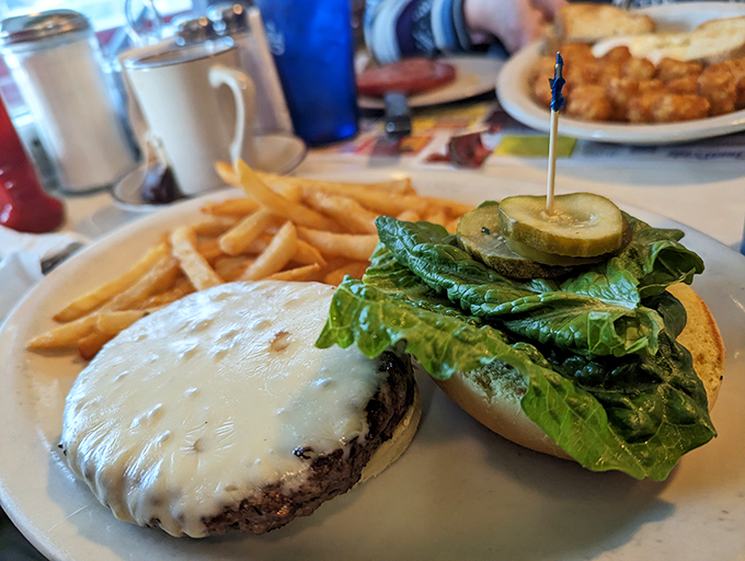 The burger – America's favorite handheld masterpiece. That melted cheese blanket and fresh lettuce prove simplicity is the ultimate sophistication.