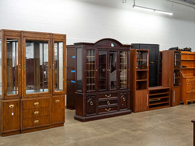 Stately wooden cabinets stand like sentinels of a bygone era, when furniture was built to outlast mortgages and survive multiple generations.
