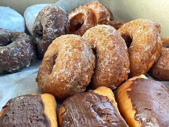 These cake donuts huddle together like old friends at a reunion, each one perfectly bronzed and ready for their coffee bath.