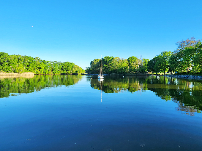 Mirror, mirror on the water. This glass-like reflection creates a perfect symmetry that makes photographers weak at the knees.