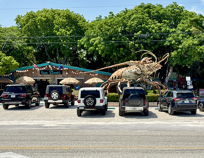 Betsy looms over the parking lot like a benevolent seafood deity, blessing visitors' vehicles with her outstretched antennae.