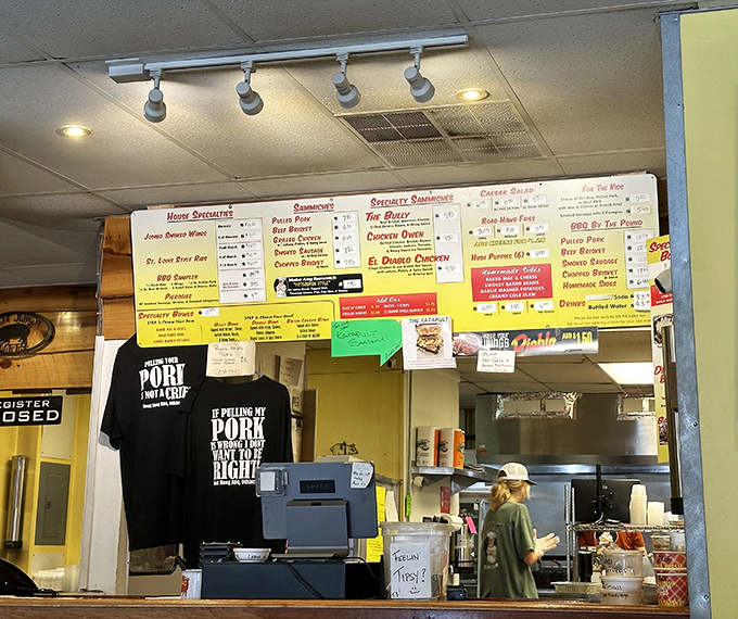 Behind the counter where barbecue magic happens&mdash;those t-shirts speak truth: "If pulling my pork is wrong, I don't want to be right."