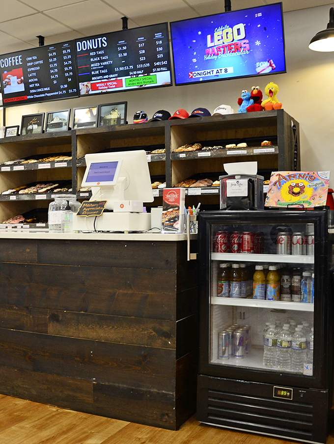 The counter area combines rustic charm with donut efficiency&mdash;where transactions are quick but the memories will last much longer.