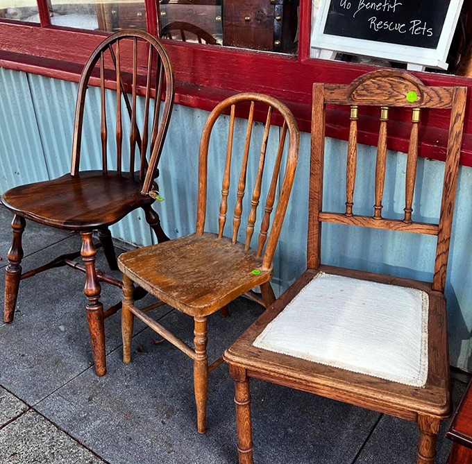 Three wooden chairs having a sidewalk conversation about their past lives and future homes. Solid craftsmanship that's outlasted countless trendy furniture fads.