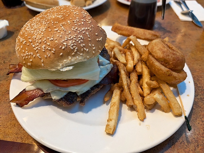 The classic diner cheeseburger&mdash;where sesame seeds meet destiny. Those golden fries aren't just a side; they're supporting characters in this lunch drama.