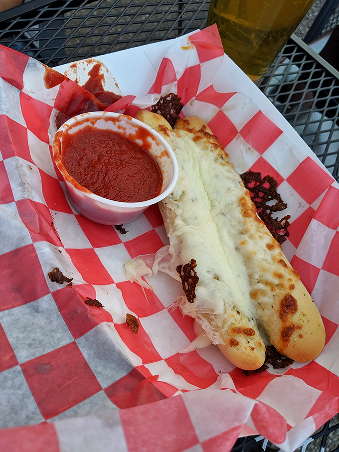 The cheesy breadstick—proof that sometimes the simplest pleasures deliver the most satisfaction, especially with that side of marinara.