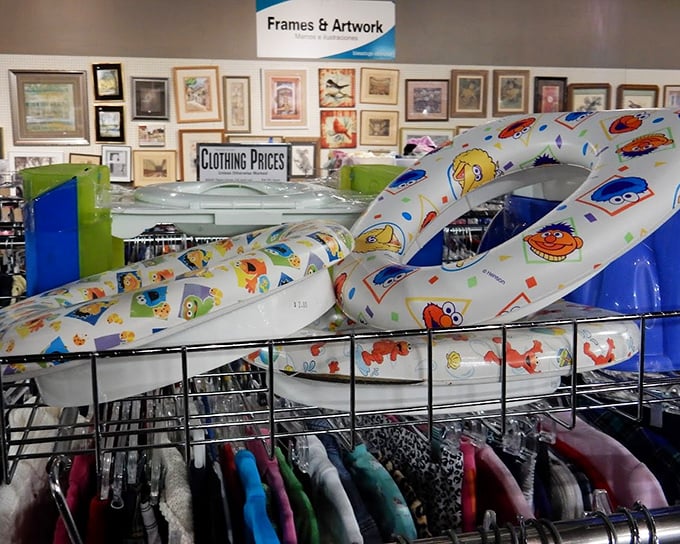 Sesame Street swim rings hanging above tiny clothes&mdash;childhood nostalgia in every aisle. Today's impulse purchase is tomorrow's "remember when they were small enough for this?"