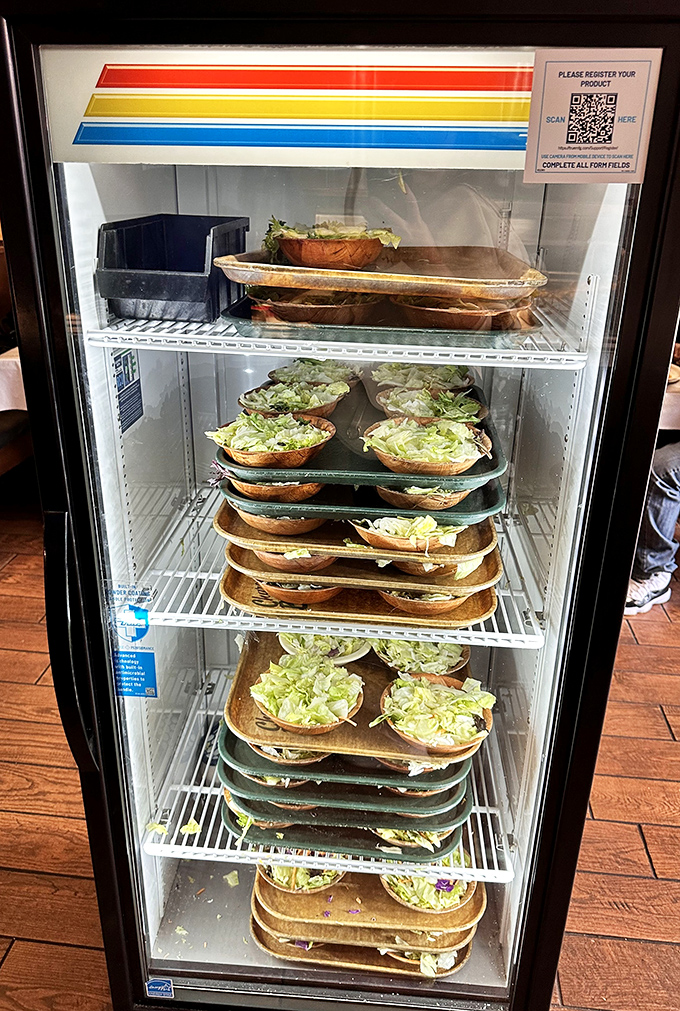 Pre-prepped salads waiting their turn &ndash; because sometimes efficiency trumps tableside preparation when hunger is on the line.